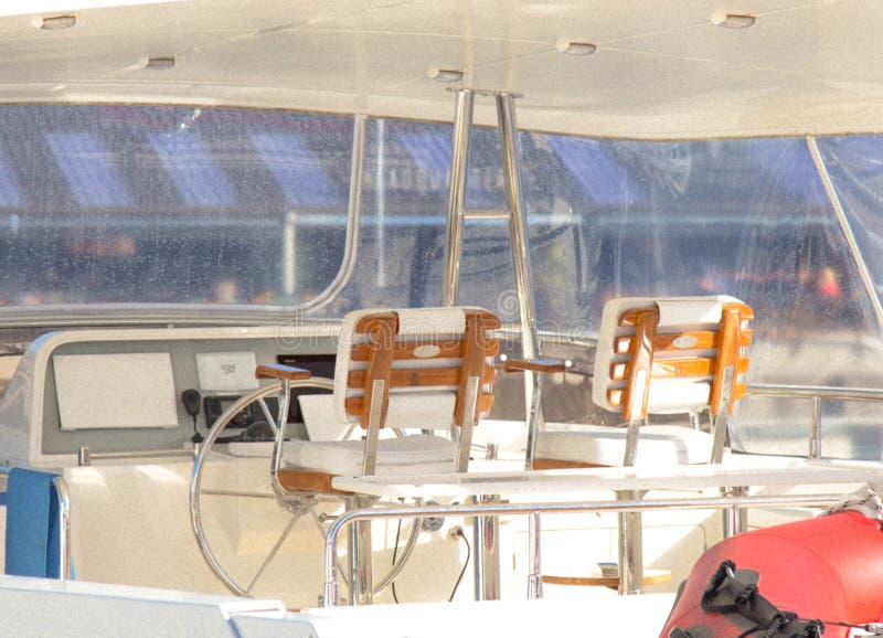 Cockpit of the Boat with Metal Handle and Wooden Chairs Stock Photo ...