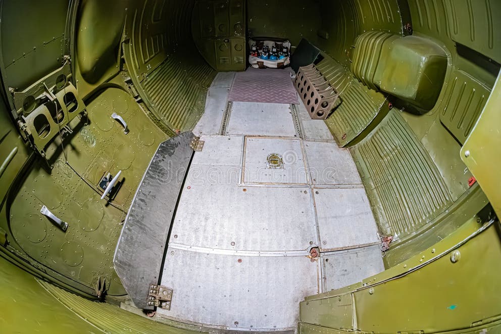 Cockpit Interior View, Primarily Green Control Panels and Dials ...