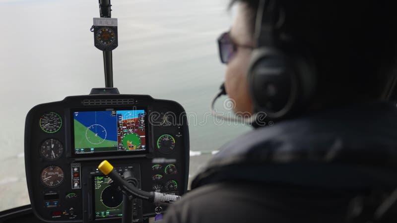 Cockpit View from a Helicopter with Pilot, Showcasing Instruments Stock ...