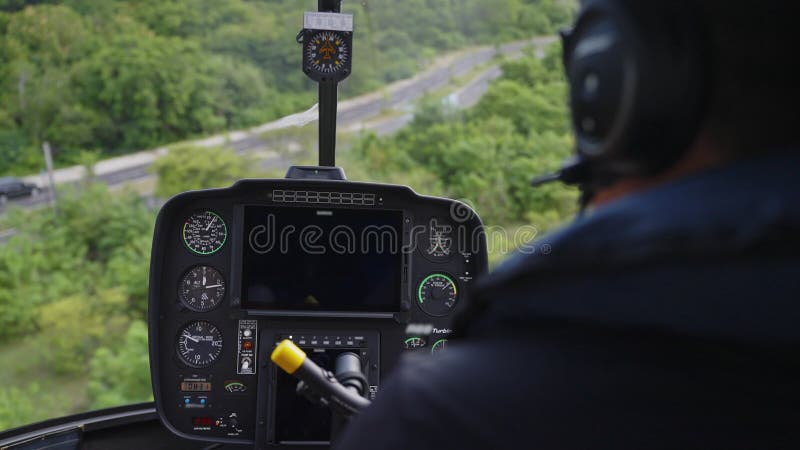 Cockpit View from a Helicopter with Pilot, Showcasing Instruments Stock ...