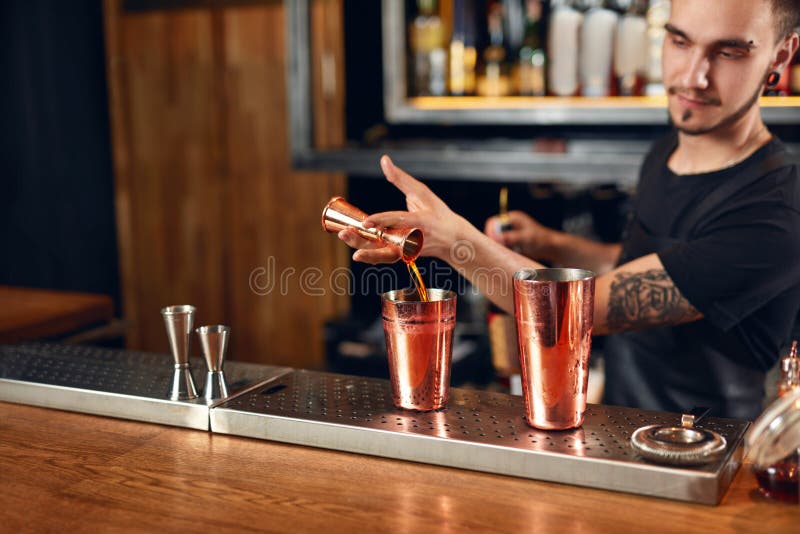 Cocktail. Bartender Making Cocktails in Bar Stock Photo - Image of ...
