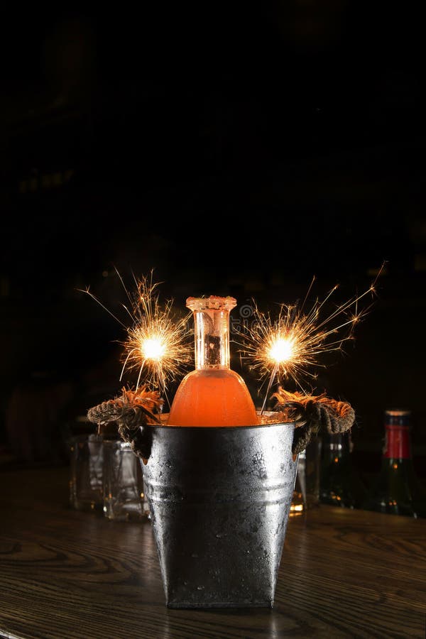 Cocktail Bottle in Tin Can with Firework Sparkler Stock Photo - Image ...