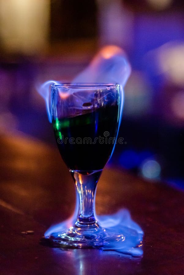 Cocktail Burning with Fire on the Bar Table during Evening Stock Photo ...