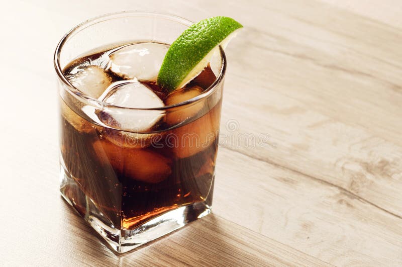 Cocktail with cola and ice stock image. Image of macro - 54958371