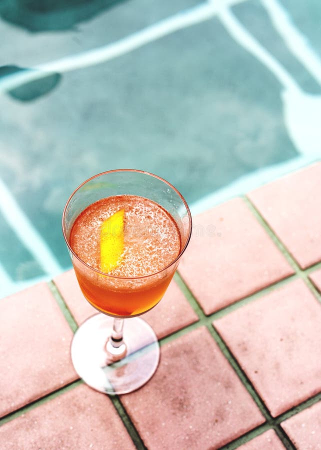 Cocktail drink by the pool stock image. Image of side - 116369699