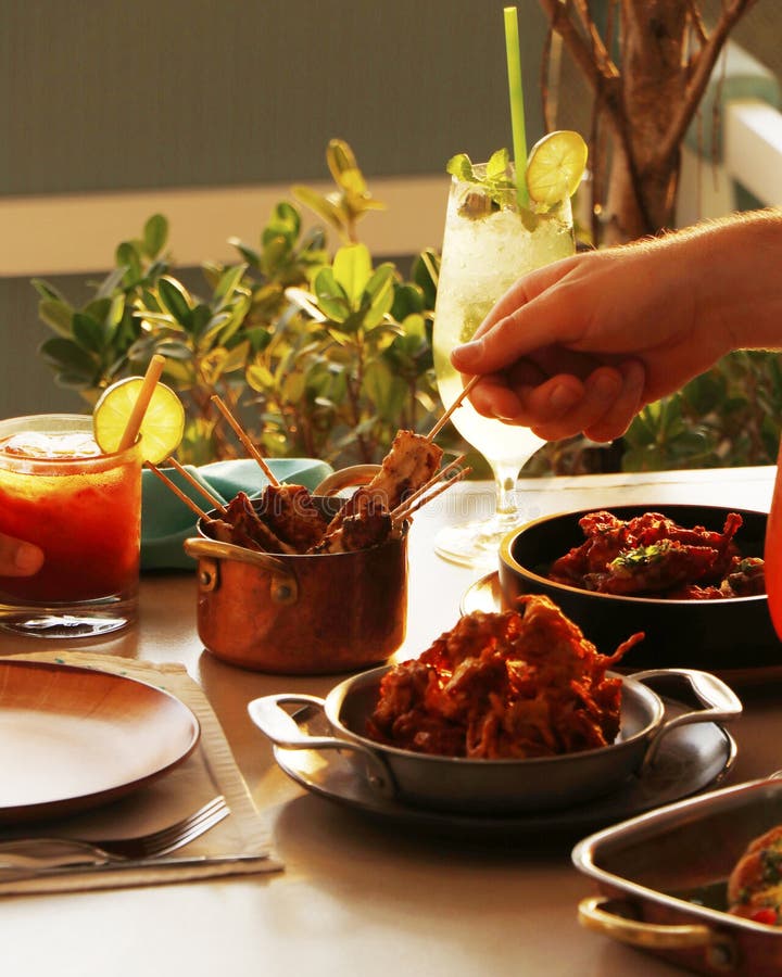 Cocktail Drinks and Paired Foods on a Dining Table Stock Photo - Image ...