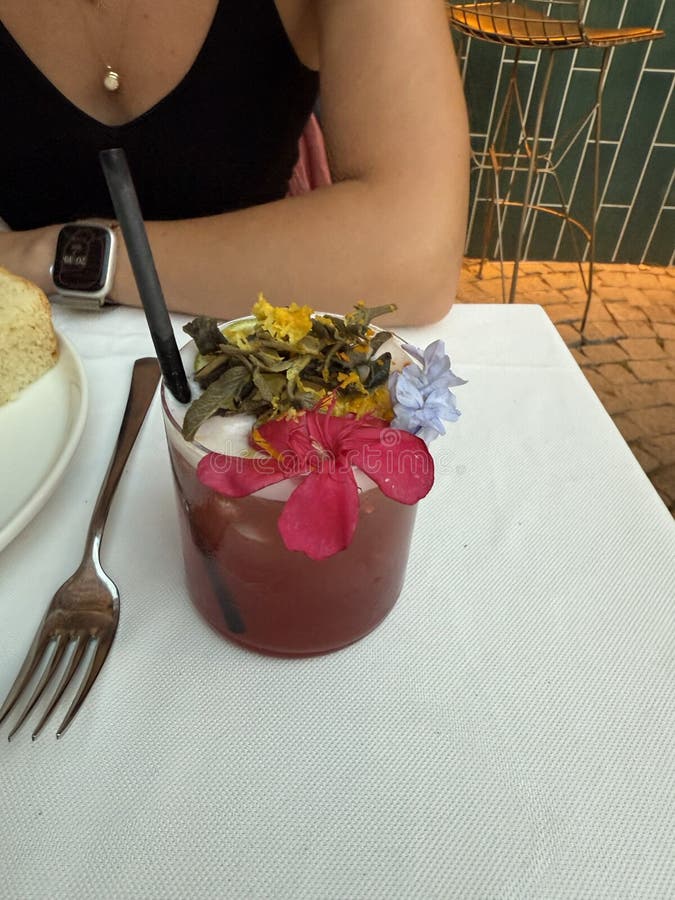 Cocktail with Edible Flower Served at Restaurant Stock Photo - Image of ...