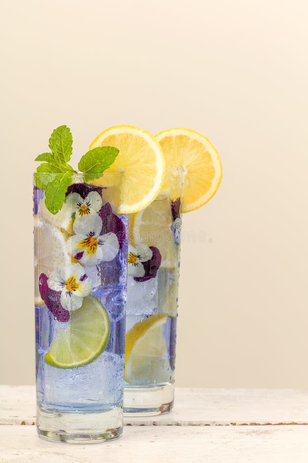 Violet Drink with Edible Flowers Stock Image - Image of aroma, lemon ...