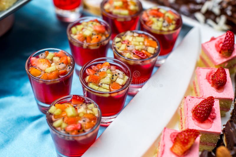 Cocktail with Fruit Pieces in a Glass Stock Image - Image of fruit ...