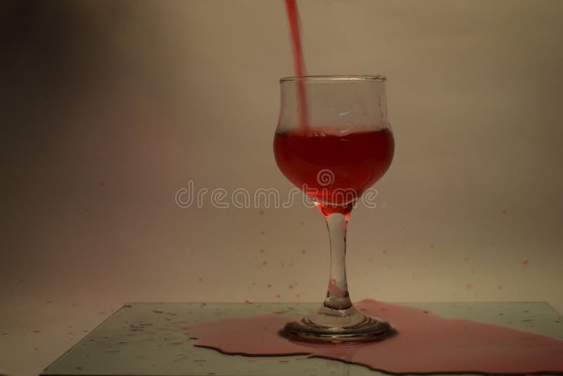 Cocktail Glass and Red Water Spilled Stock Image - Image of table ...