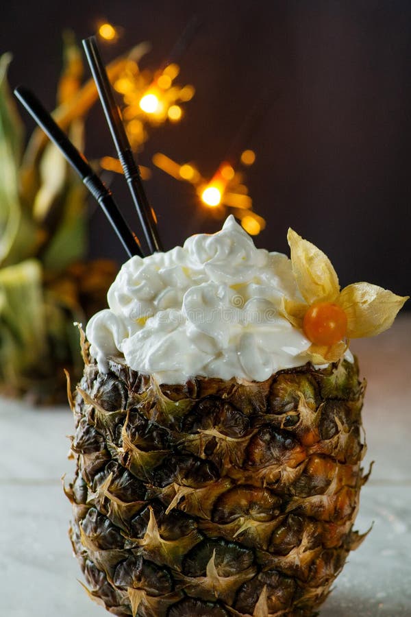 Cocktail in pineapple stock image. Image of beverage - 138226163