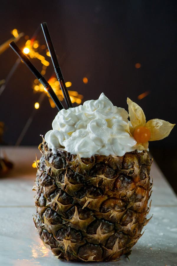 Cocktail in pineapple stock photo. Image of mixer, mixed - 138226166