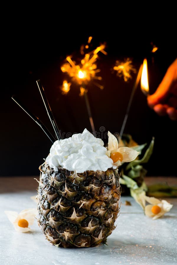 Cocktail in pineapple stock image. Image of beverage - 138226163