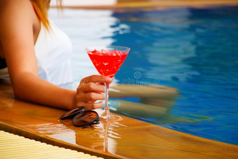 Cocktail by the poolside stock image. Image of summer - 92847599