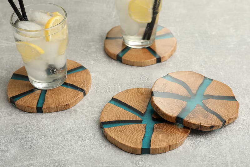 Cocktail and Stylish Cup Wooden Coasters on Light Grey Table Stock ...
