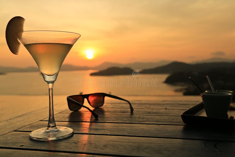 Cocktail at Sunset stock photo. Image of drinking, defocused - 42020016