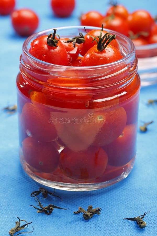 Cocktail tomatoes in jar stock photo. Image of close - 16398210