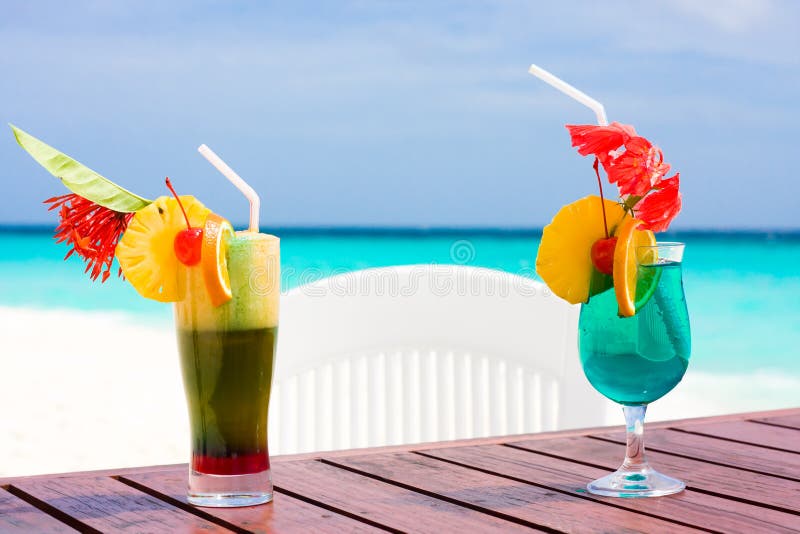 Cocktails at the beach stock photo. Image of straw, freshness - 17879892