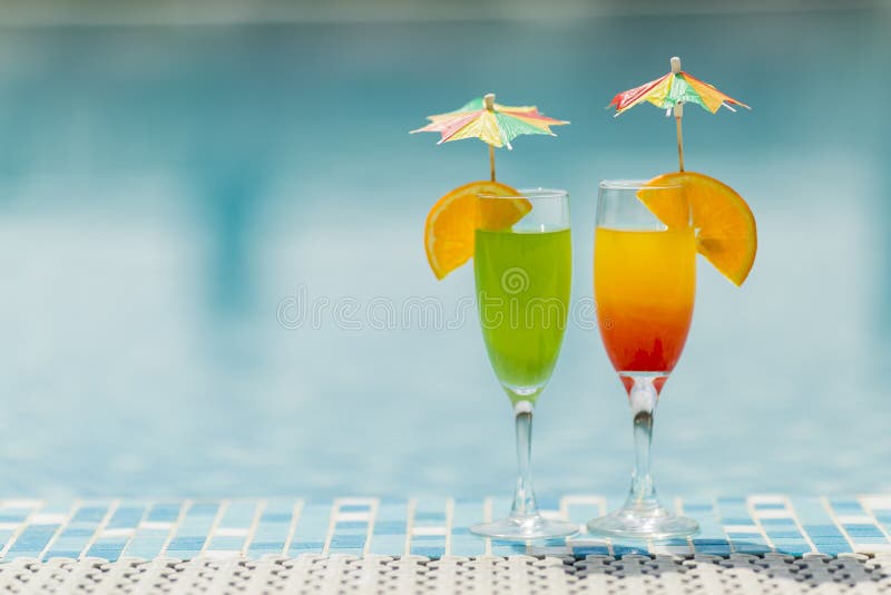 Poolside Symmetric Cocktails Served Cold at Pool Bar with Mojito and ...