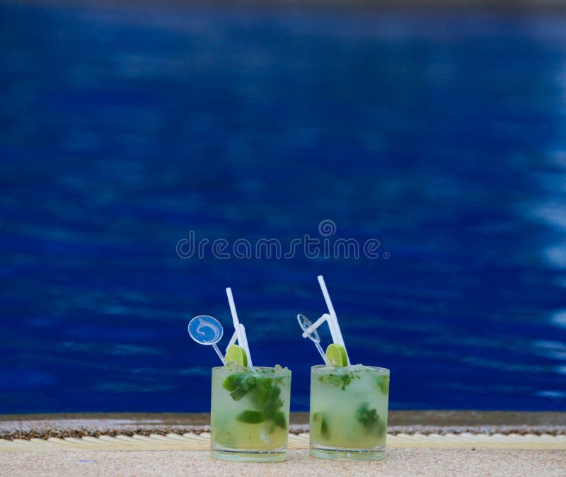 Cocktails by the pool. stock image. Image of refreshment - 35587527