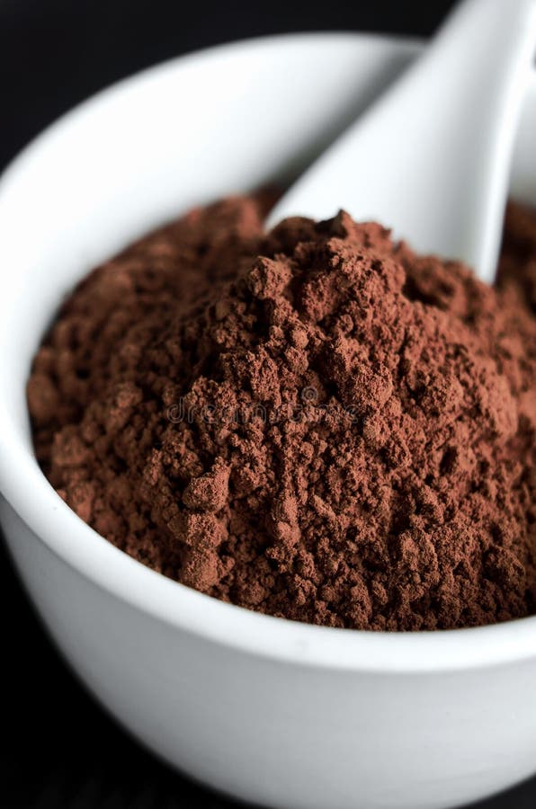 Cocoa powder in a bowl stock photo. Image of flavor, ground - 65904130