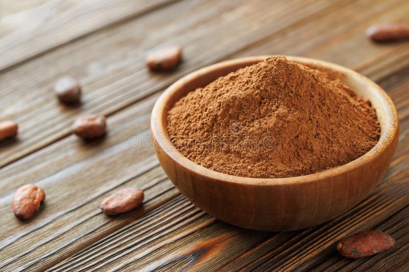Cocoa Powder in Bowl and Raw Cocoa Beans on Table Stock Photo - Image ...