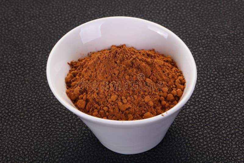 Cocoa powder in the bowl stock image. Image of chocolate - 193911033