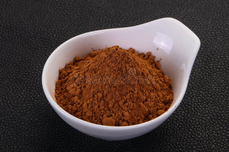 Cocoa powder in the bowl stock photo. Image of flavor - 195277510
