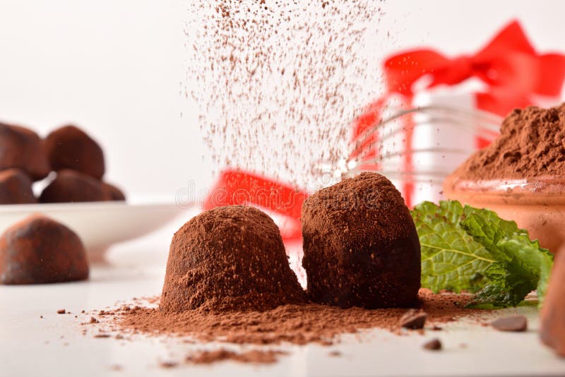 Cocoa Powder Falling on Chocolate Truffles Prepared for an Event Stock ...