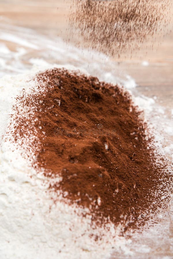 Cocoa Sift into Flour stock image. Image of black, pastry - 3584459