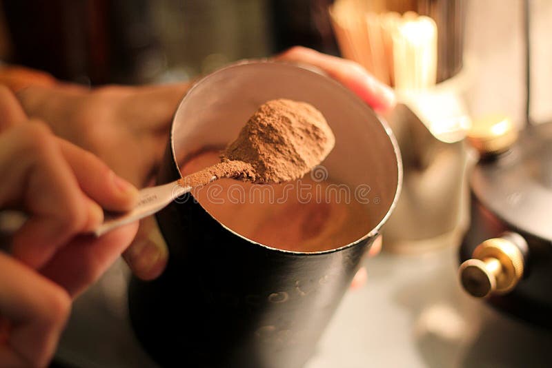 Cocoa powder on spoon stock photo. Image of food, white - 140569142