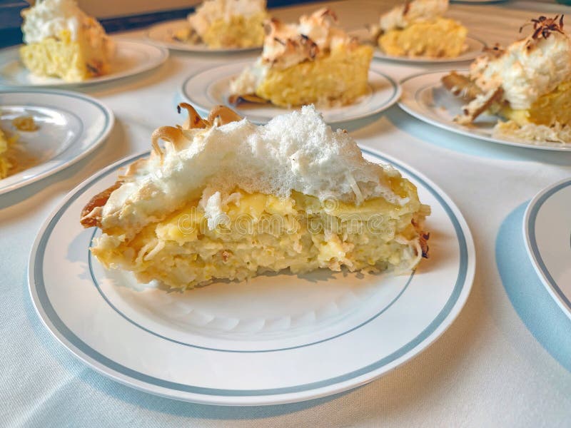 Coconut Cream Pie Slices on Plates Stock Photo - Image of silver, table ...