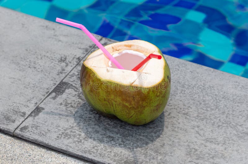 Coconut with a Straw Near the Pool Stock Photo - Image of beach ...