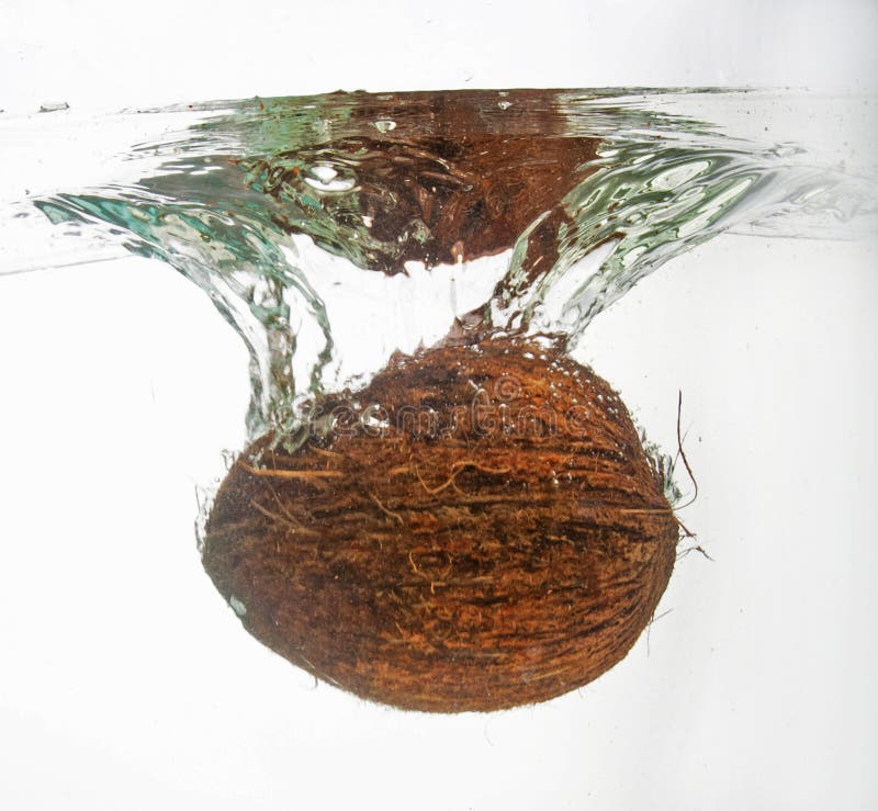 Coconut in Water Splash with Emerald Toning Stock Photo - Image of ...