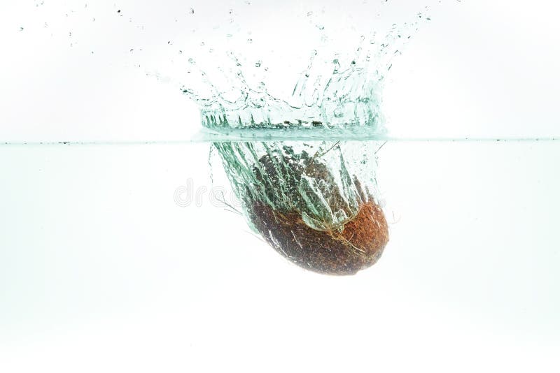 Coconut in Water Splash with Emerald Toning Stock Photo - Image of ...