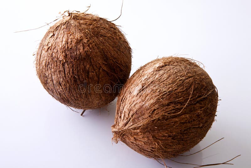 Coconut. Whole Coconut, Shell from Coconut and Green Leaves on a Wooden ...