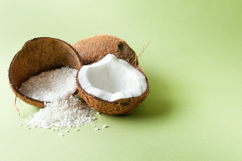 Coconuts Whole and Halved. Coconut Flakes are Poured into the Coconut ...
