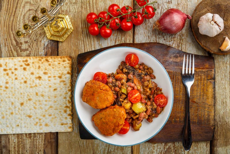 Cod Cutlets with Potatoes and Vegetables on a Round Stand Next To the ...