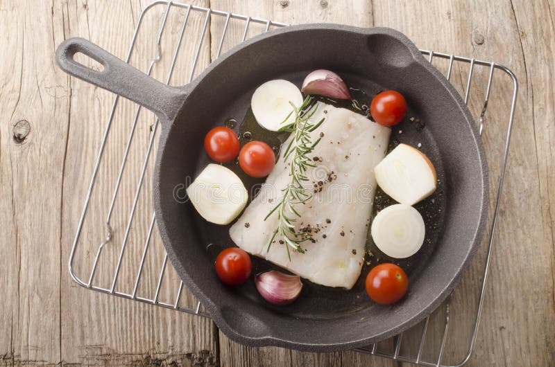 Cod Fillet in a Cast Iron Pan Stock Image - Image of food, garlic: 45056757