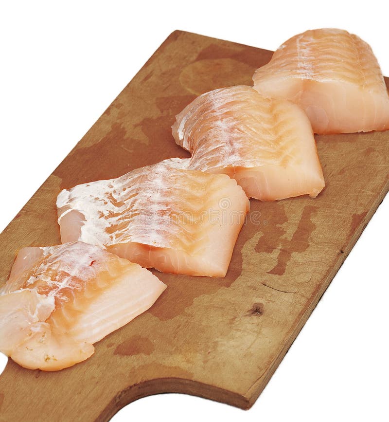 Cod Fillet in Pieces on the Cutting Board Stock Photo - Image of dinner ...