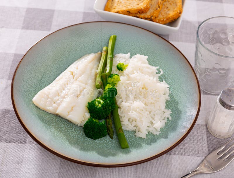 Cod Fillet Served with Rice and Steamed Broccoli an Attractive ...