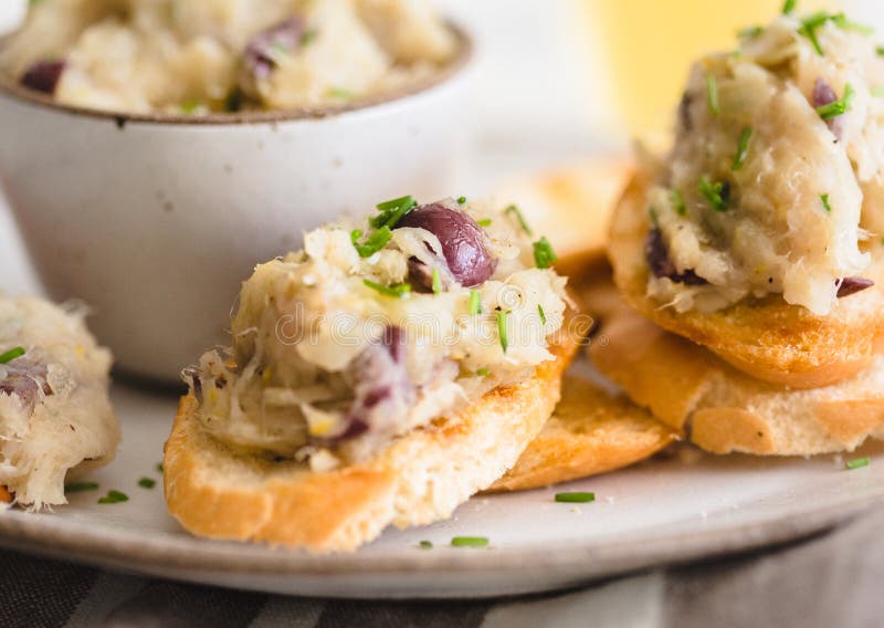 Cod Fish Brandade on a White Ceramic and Rustic Napkin Stock Photo ...