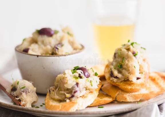 Cod Fish Brandade on a White Ceramic and Rustic Napkin Stock Image ...