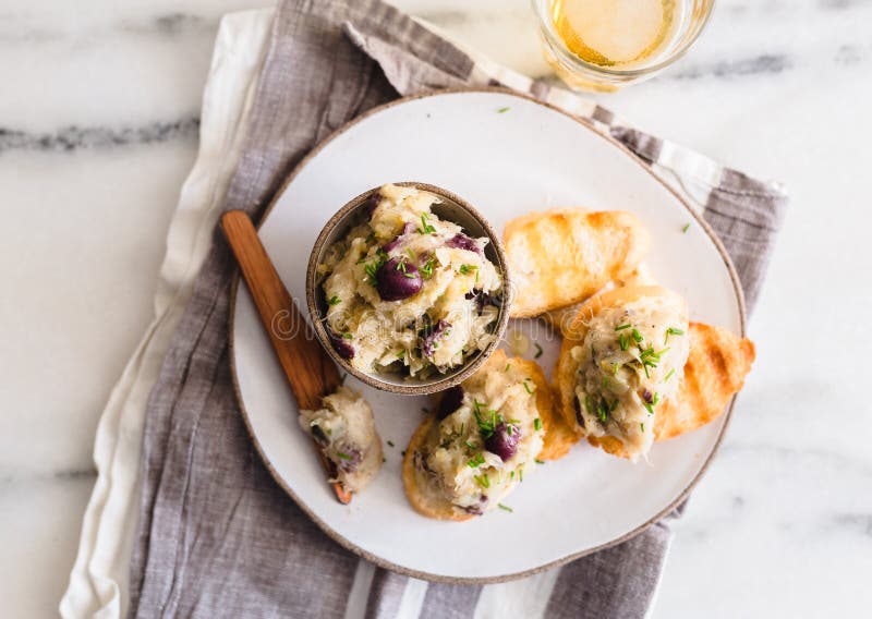 Cod Fish Brandade on a White Ceramic and Rustic Napkin Stock Image ...