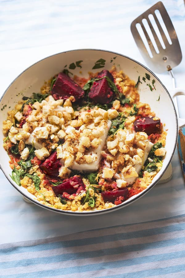 Cod Fish with Breadcrumbs, Beetroot, Spinach and Lentils Stock Photo ...
