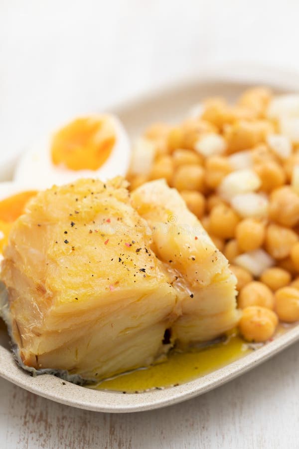 Cod Fish with Chick Pea and Boiled Egg on Dish Stock Photo - Image of ...