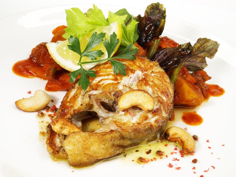 Cod Fish Chop on Tomato stock image. Image of grilled - 146826797