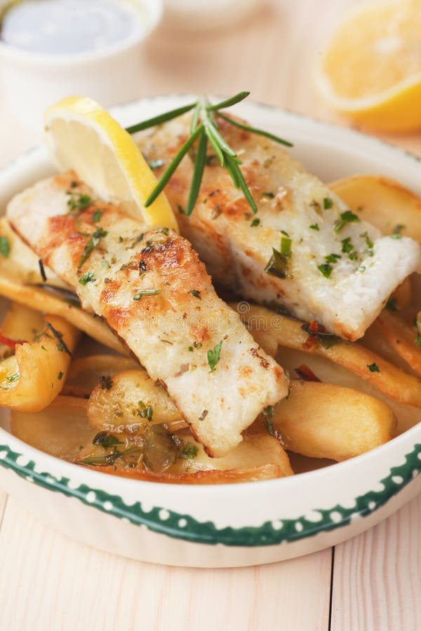 Cod Fish Steak with Fried Potato and Lemon Stock Photo - Image of ...