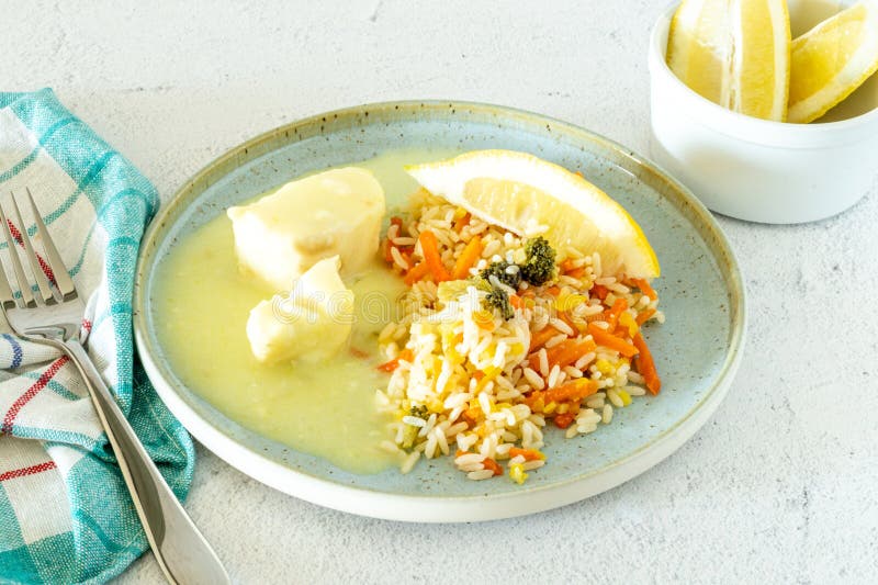 Cod Fish Steak in Lemon Sauce and Vegetable Rice Dis Stock Photo ...
