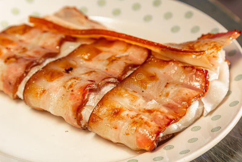 Cod fish wrapped in bacon stock image. Image of grilled - 249026005